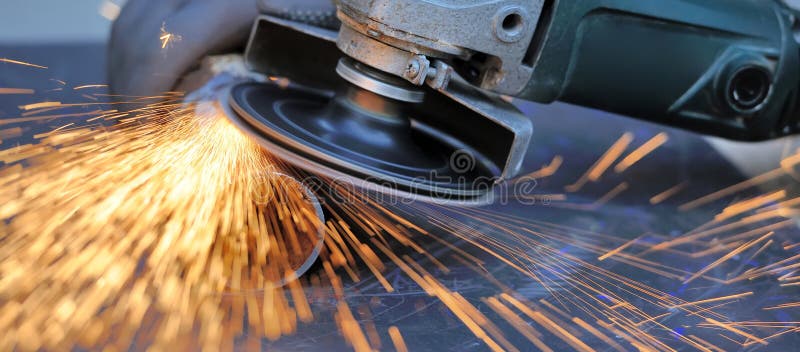 Worker cutting metal with grinder - Stock Image - Everypixel