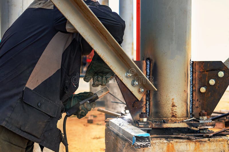 Worker Cutting Metal Plate by Gas Cutting Torch at a Construction Site ...