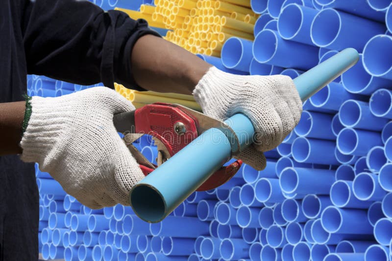 Worker cutting pvc pipe stock image. Image of circle - 30092785