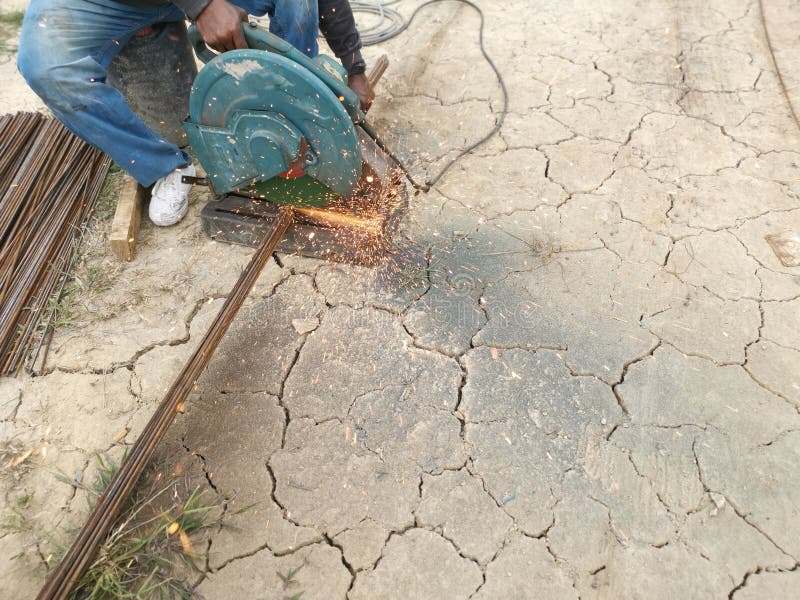 Worker Cutting Rebar Metal with the Iron Cutter Machine. Stock Image ...