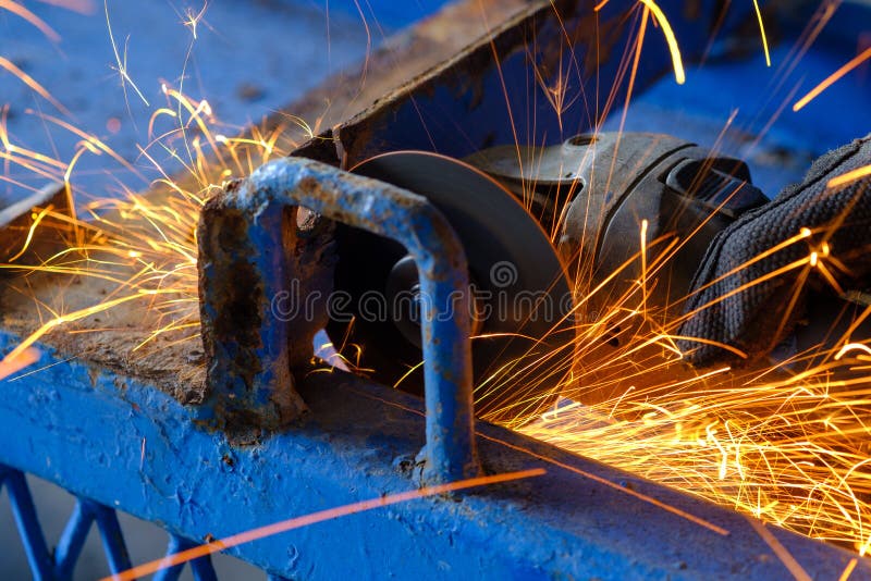 Worker Cutting Steel with Grinding Machine and Splashes of Sparks in ...