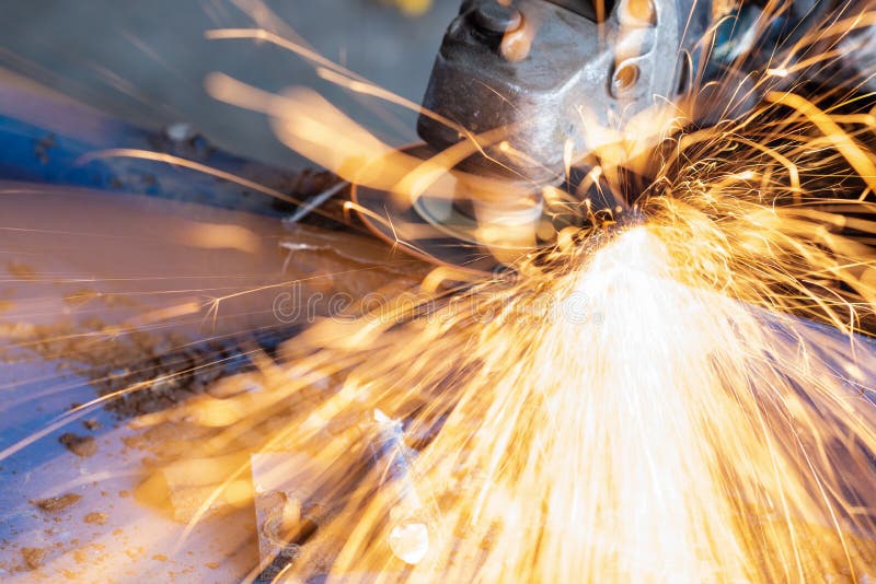 Worker Cutting Steel with Grinding Machine and Splashes of Sparks in ...