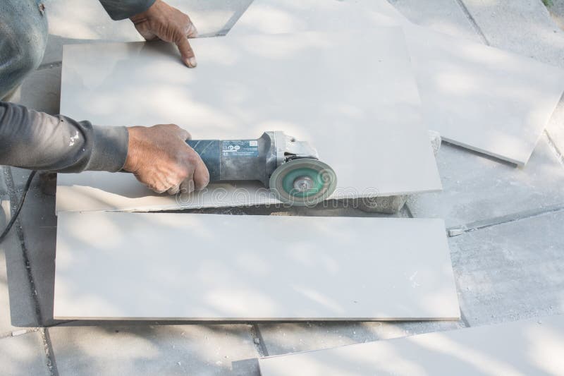Worker Cutting a Tile Using an Angle Grinder Stock Photo - Image of circular, industry: 274375914