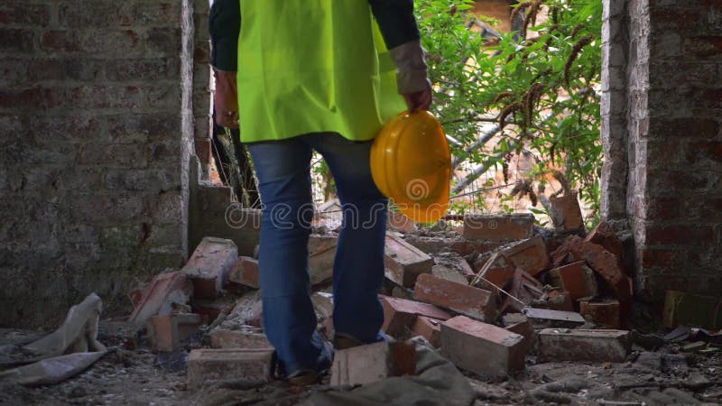 Worker in Demolished Building with Hard Hat Stock Video - Video of ...