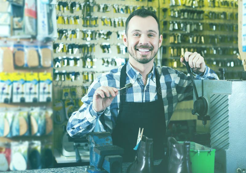 Worker Demonstrating Newly Shaped Key Stock Image - Image of person ...
