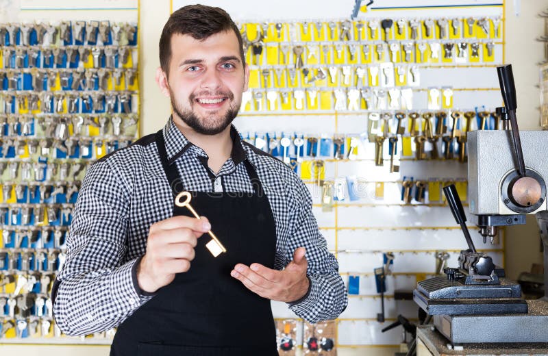 Worker Demonstrating Newly Shaped Key Stock Photo - Image of ...