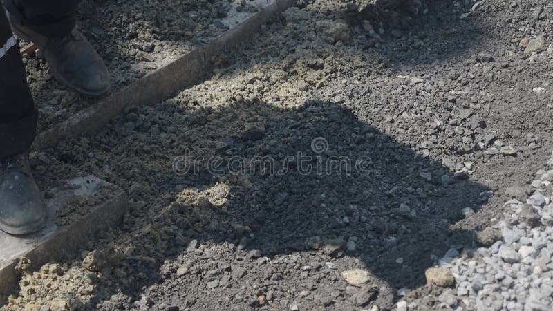 CloseUp of a Construction Site a Worker Actively Digging into the ...