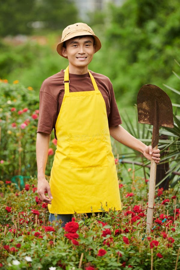 Worker Digging Out Blooming Flowers Stock Image - Image of digging ...