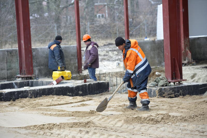 Worker Digging with a Shovel at the Construction Site Editorial Photo ...