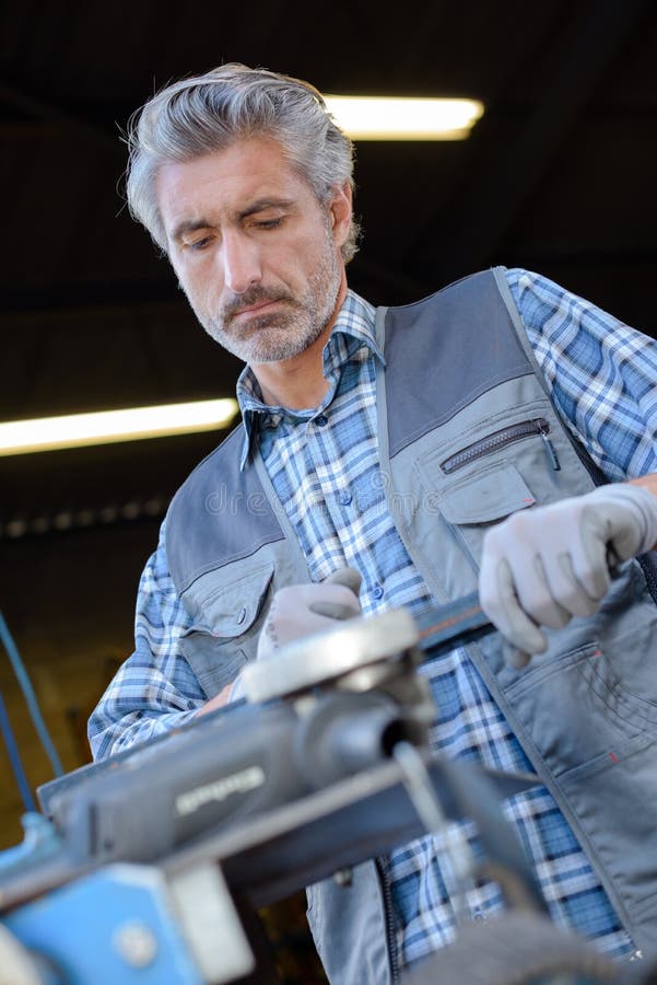 Worker doing his job stock image. Image of artisan, laborer - 127760277