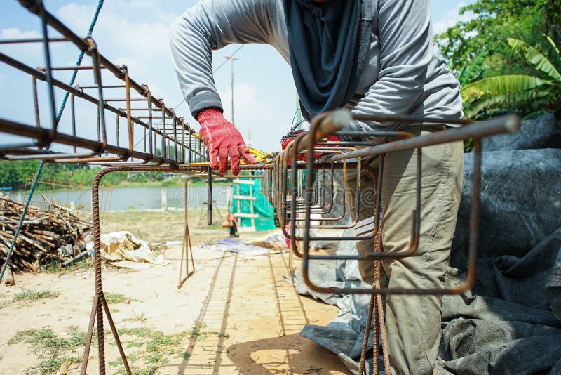 Worker Doing the Steelwork for Reinforcement of the Concrete Structure ...