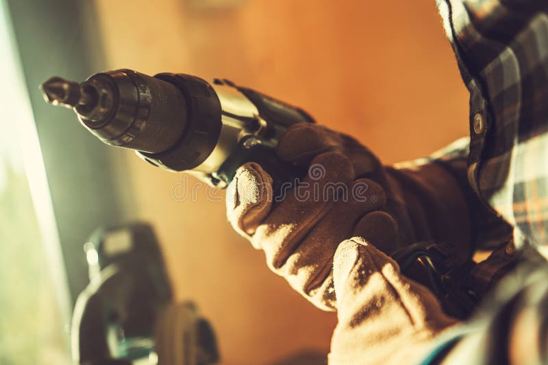 Worker with Drill Driver in His Hand Close Up Stock Photo - Image of ...
