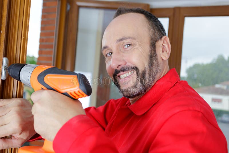 Worker Drilling Holes in Construction Frame Stock Photo - Image of ...