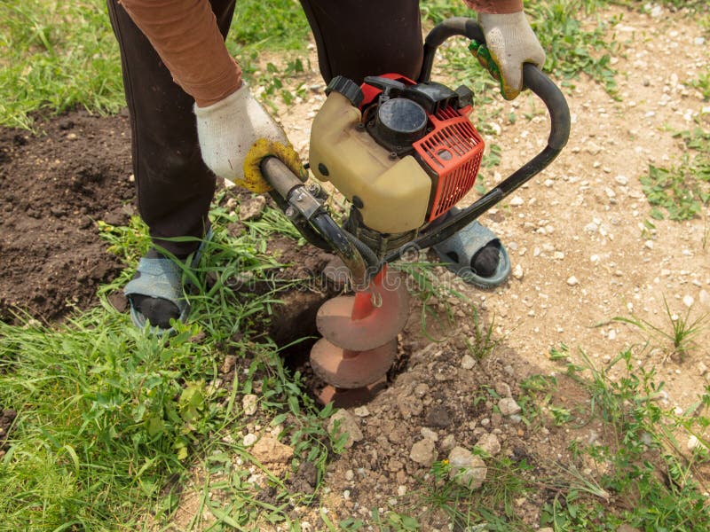 Worker Drills the Ground at the Construction Site Stock Photo - Image ...