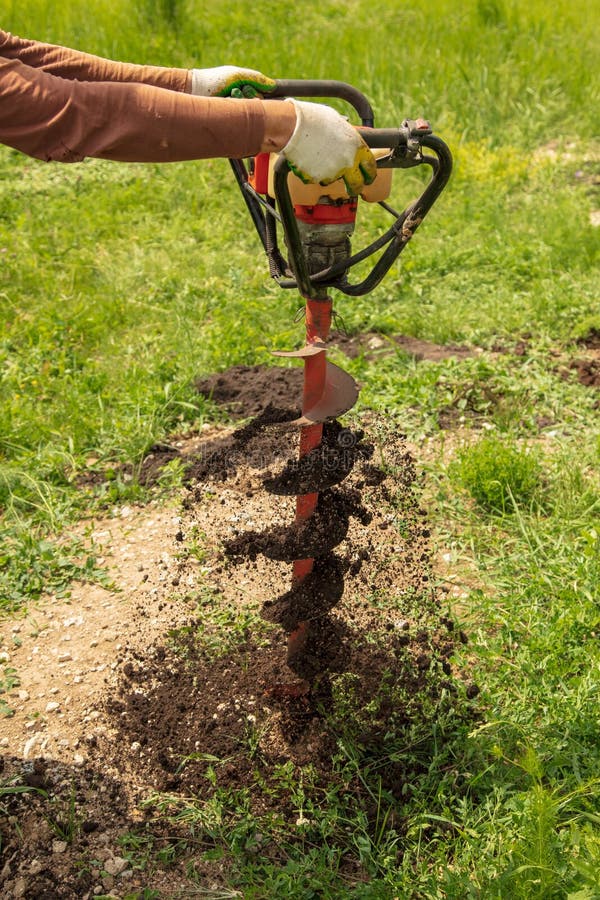 Worker Drills the Ground at the Construction Site Stock Photo - Image ...