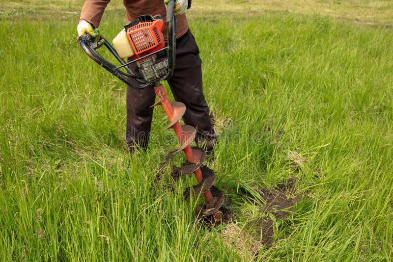 Worker Drills the Ground at the Construction Site Stock Image - Image ...