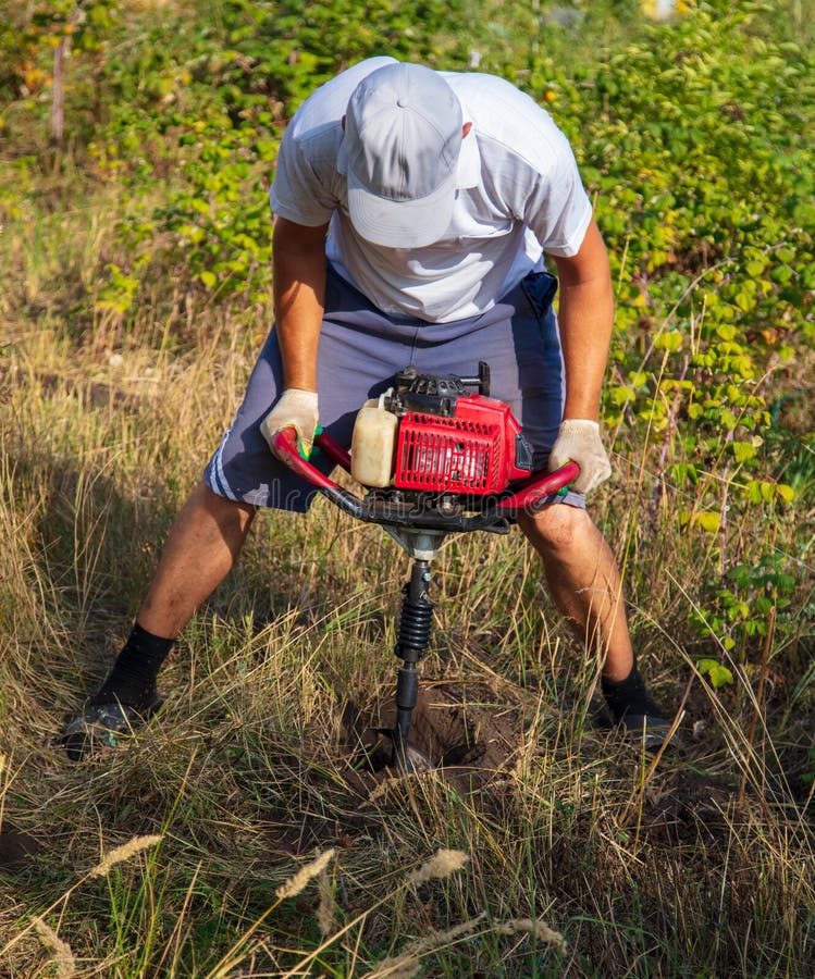 Worker Drills the Ground at the Construction Site Stock Image - Image ...