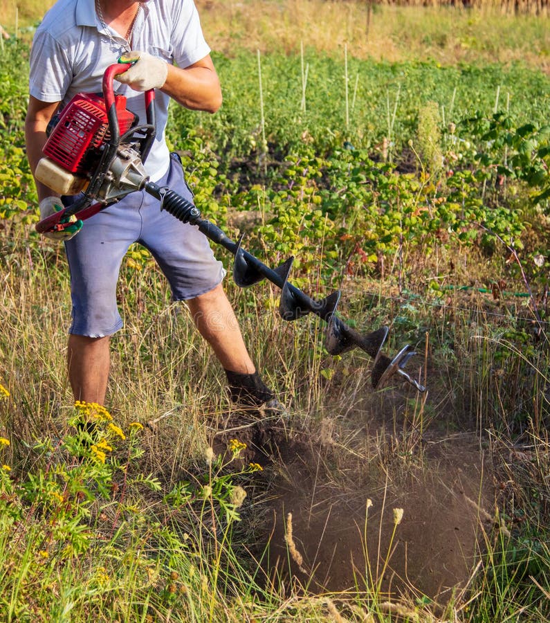Worker Drills the Ground at the Construction Site Stock Image - Image ...