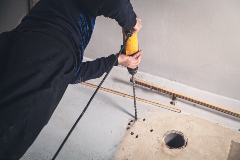 Worker Drills a Wall with a Perforator Stock Photo - Image of craftsman ...