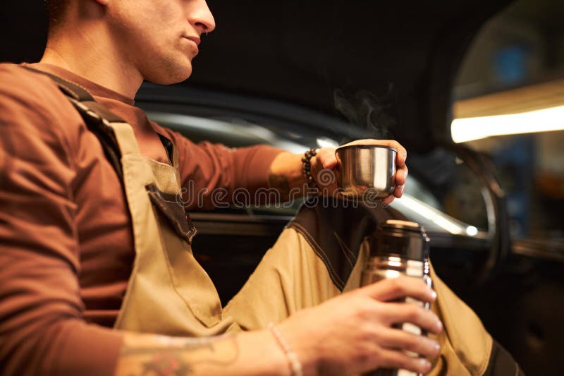 Worker Drinking Hot Drink during Break Stock Image - Image of workshop ...