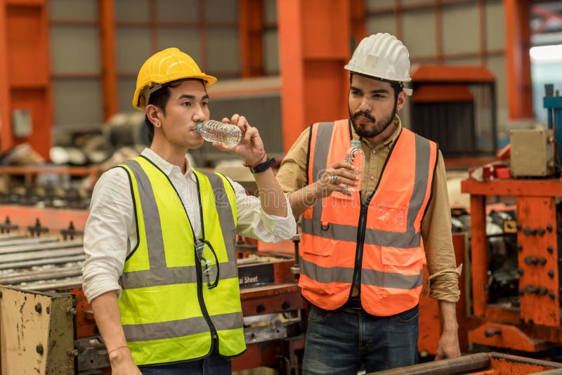 Worker Drinking Water in Factory Site. Stock Image - Image of industry ...