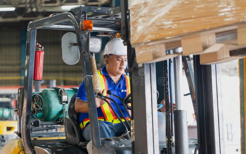 Worker Driver at Warehouse Forklift Loader Works To Containers Box ...