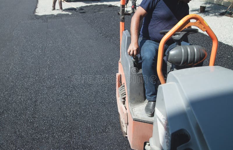 Worker Driving Asphalt Machine. Road Construction Stock Image - Image ...