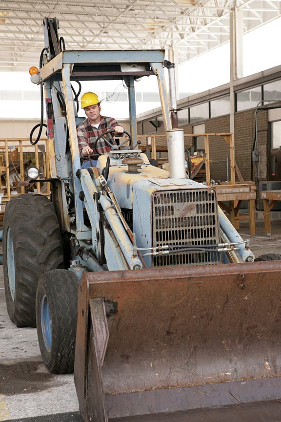 Worker Driving Backhoe stock photo. Image of jobsite, driver - 1394672