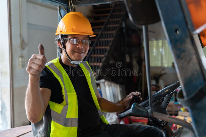 A Worker Driving a Forklift in Warehouse Stock Photo - Image of factory ...