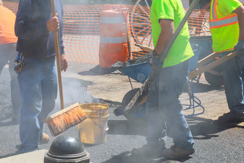 Worker is Engaged in Repairing Damaged Part of a Reconstruction Road ...