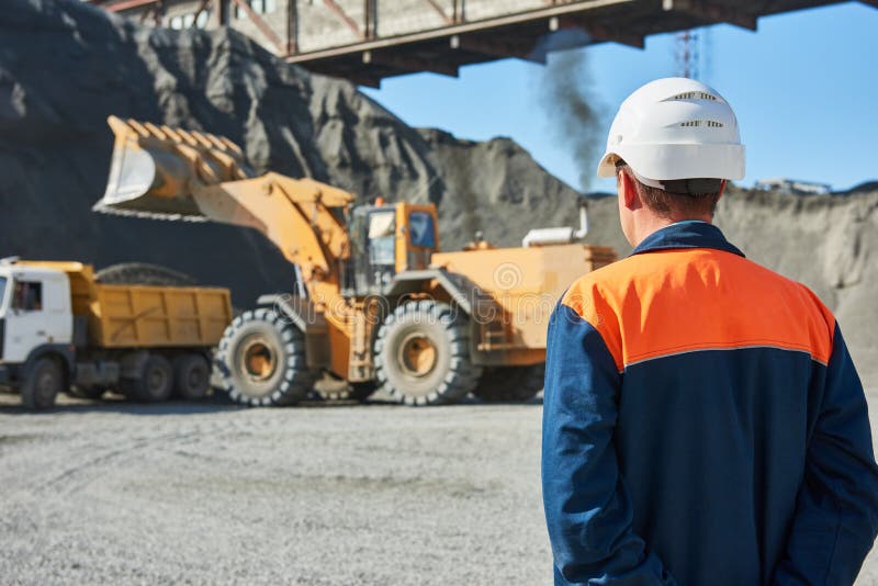 Worker Engineer Looks on Wheel Loader Loading Truck Stock Image - Image ...