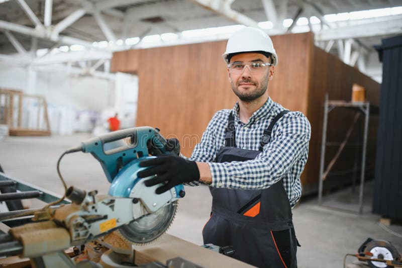 A Worker or Engineer in a Uniform Works on a Construction Site for the ...
