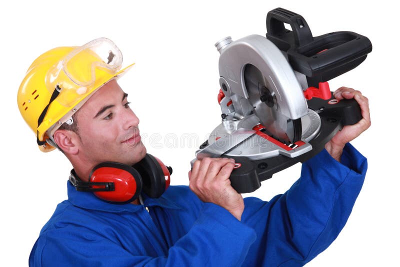 Worker Examining His Circular Saw. Stock Photo - Image of carrying ...