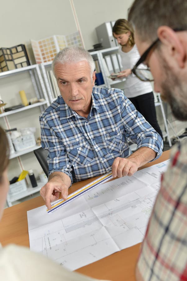 Worker Explaing Choices To Client Stock Photo - Image of curious ...