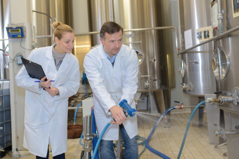 Worker factory cleaning stock photo. Image of cheese - 232509814