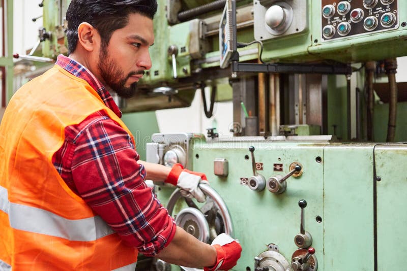 Worker in Factory Operates a Drill Press Stock Photo - Image of ...