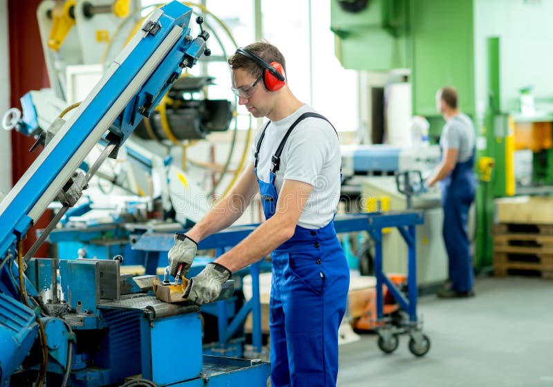 Asian Worker Using a Machine in a Factory Stock Photo - Image of asians ...