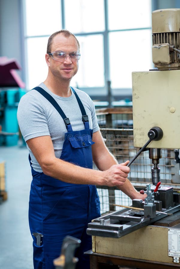 Worker in Factory Using Drill Machine Stock Photo - Image of ...