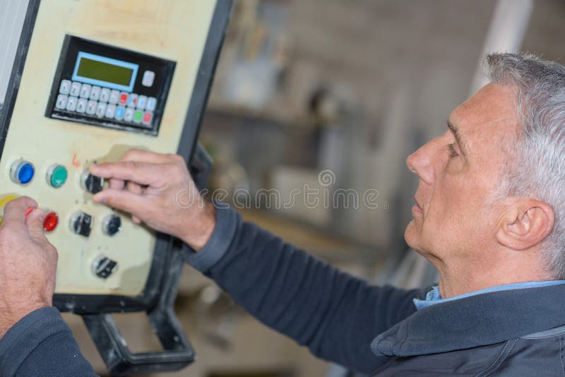 Worker in Factory Using Machine Stock Photo - Image of factory ...