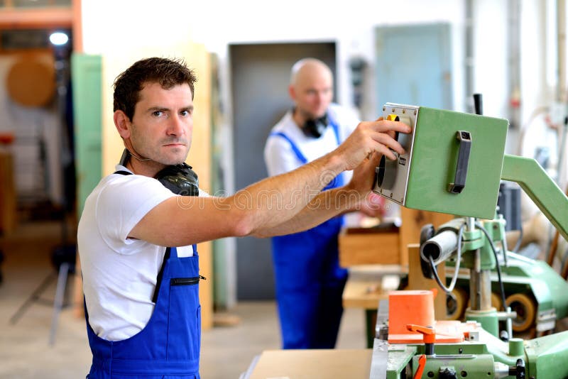 Worker in Factory Using Machine Stock Photo - Image of engineer ...