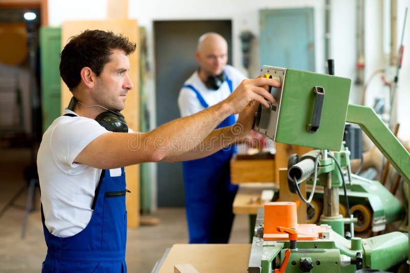 Worker in Factory Using Machine Stock Photo - Image of joinery ...