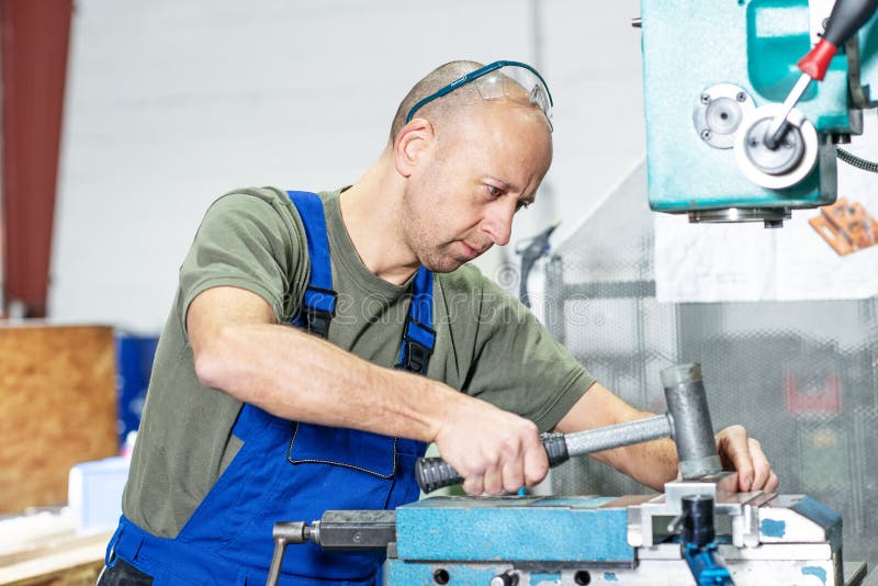 Worker in factory stock photo. Image of metal, drill - 124588914