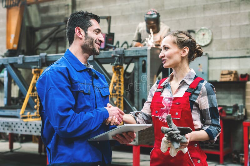 Worker in Factory or Workshop Discussing Project Stock Photo - Image of ...