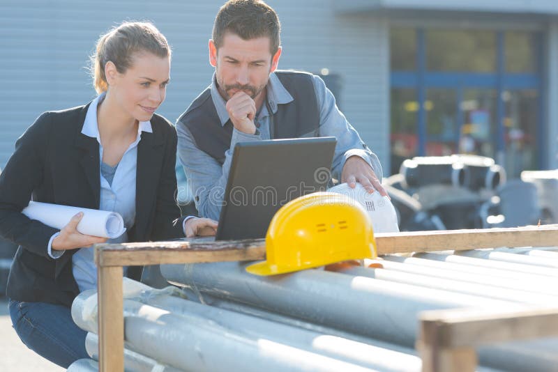 Boss and Worker in Conversation in Factory Stock Image - Image of ...