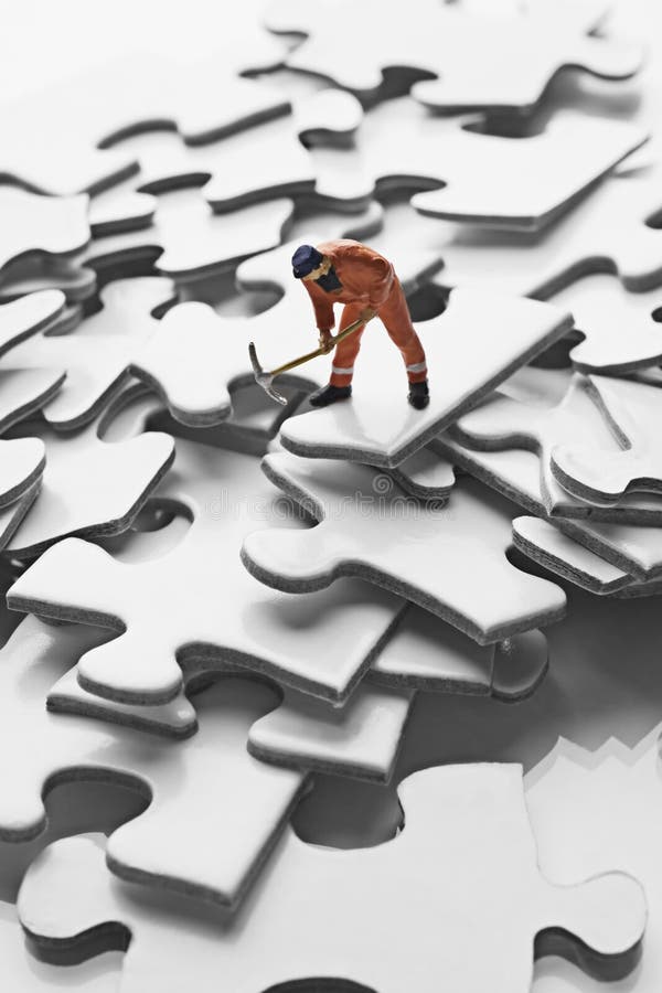 Worker Fix the Puzzle on the Table, Together Work Hard To Solve the ...