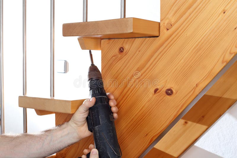 Worker is fitting stairs stock image. Image of building - 66827095