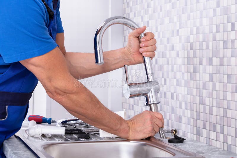 Worker Fixing Water Tap stock image. Image of services - 287570957
