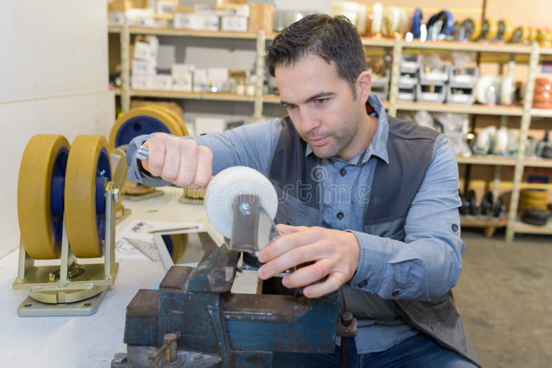 Worker Fixing Wheels in Industrial Business Stock Image - Image of ...