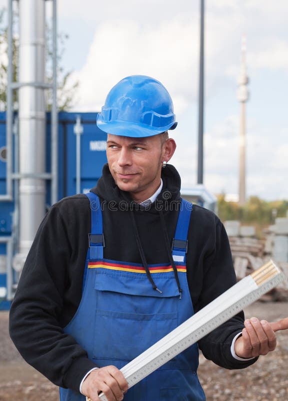 Worker with foldable ruler stock image. Image of hold - 11517169