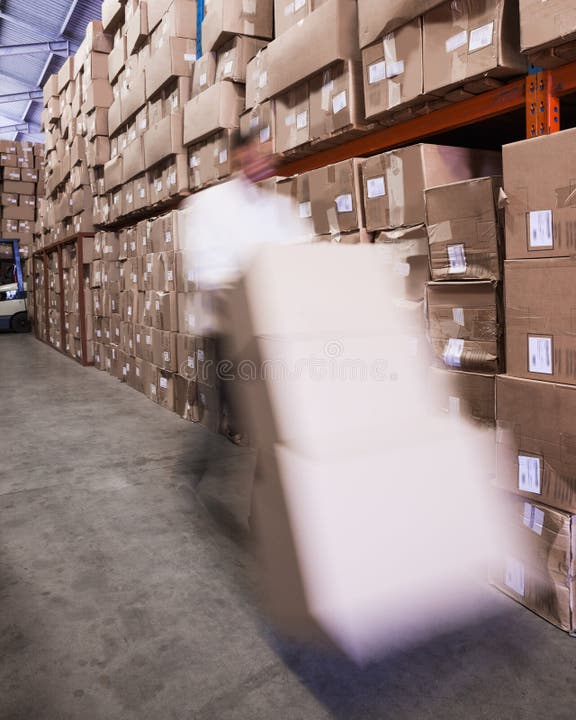 Worker with Fork Pallet Truck Stacker in Warehouse Stock Photo - Image ...